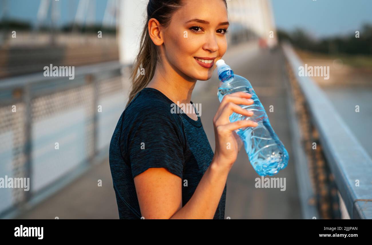 Fit Woman Runner Outdoors Holding Water Bottle Fitness Woman Taking A