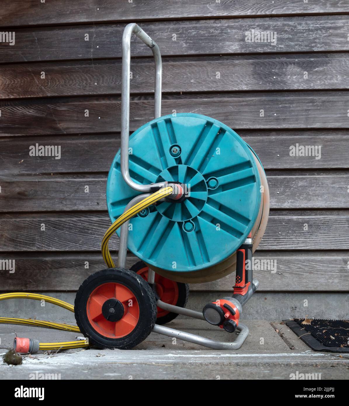 Garden blue hose reel hi-res stock photography and images - Alamy