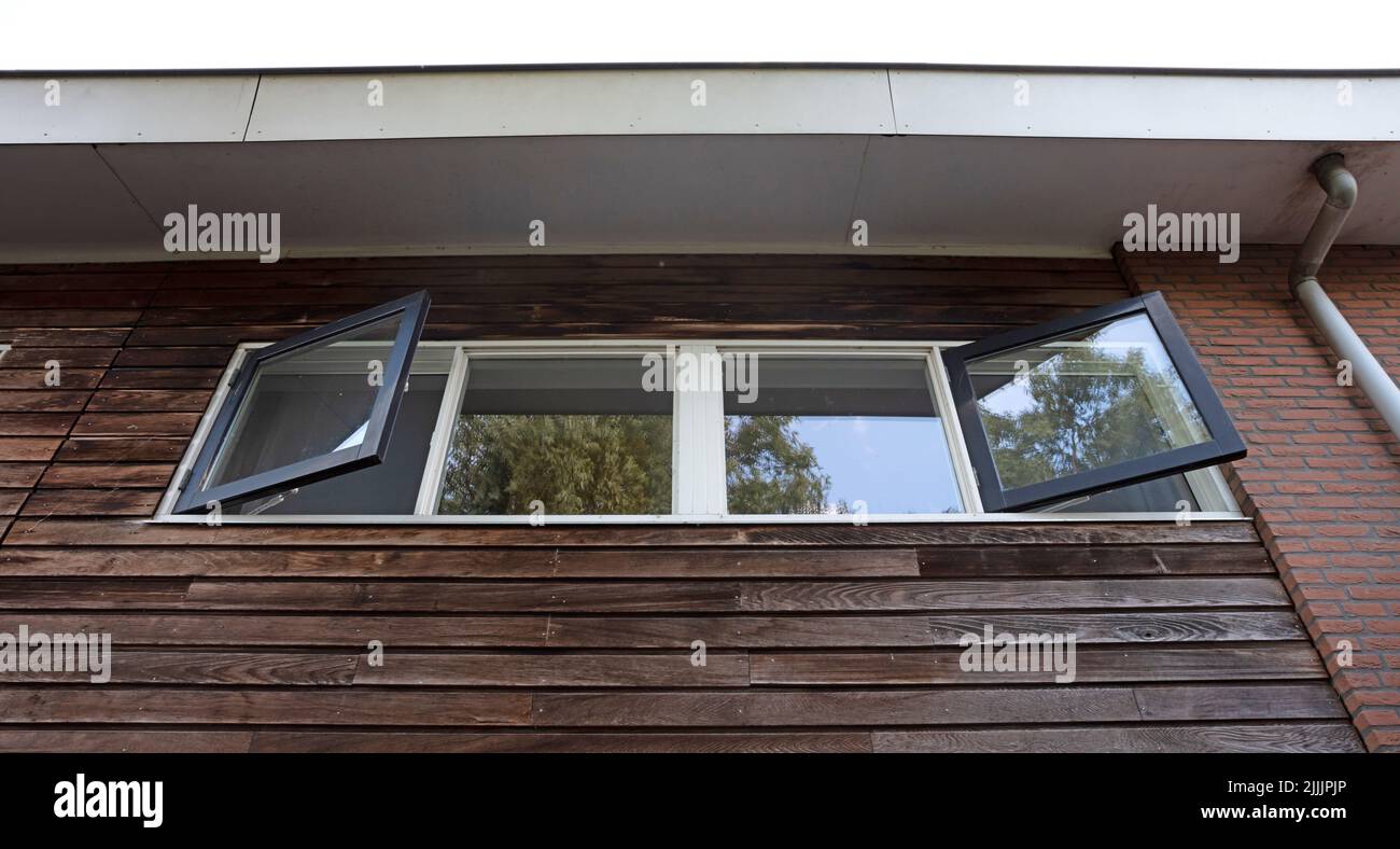 Open window on the fisrt floor of a house, getting some fresh air Stock ...