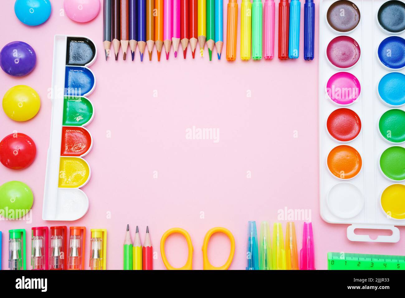 School supplies, colored pencils, watercolor paints, pens, ruler and ...