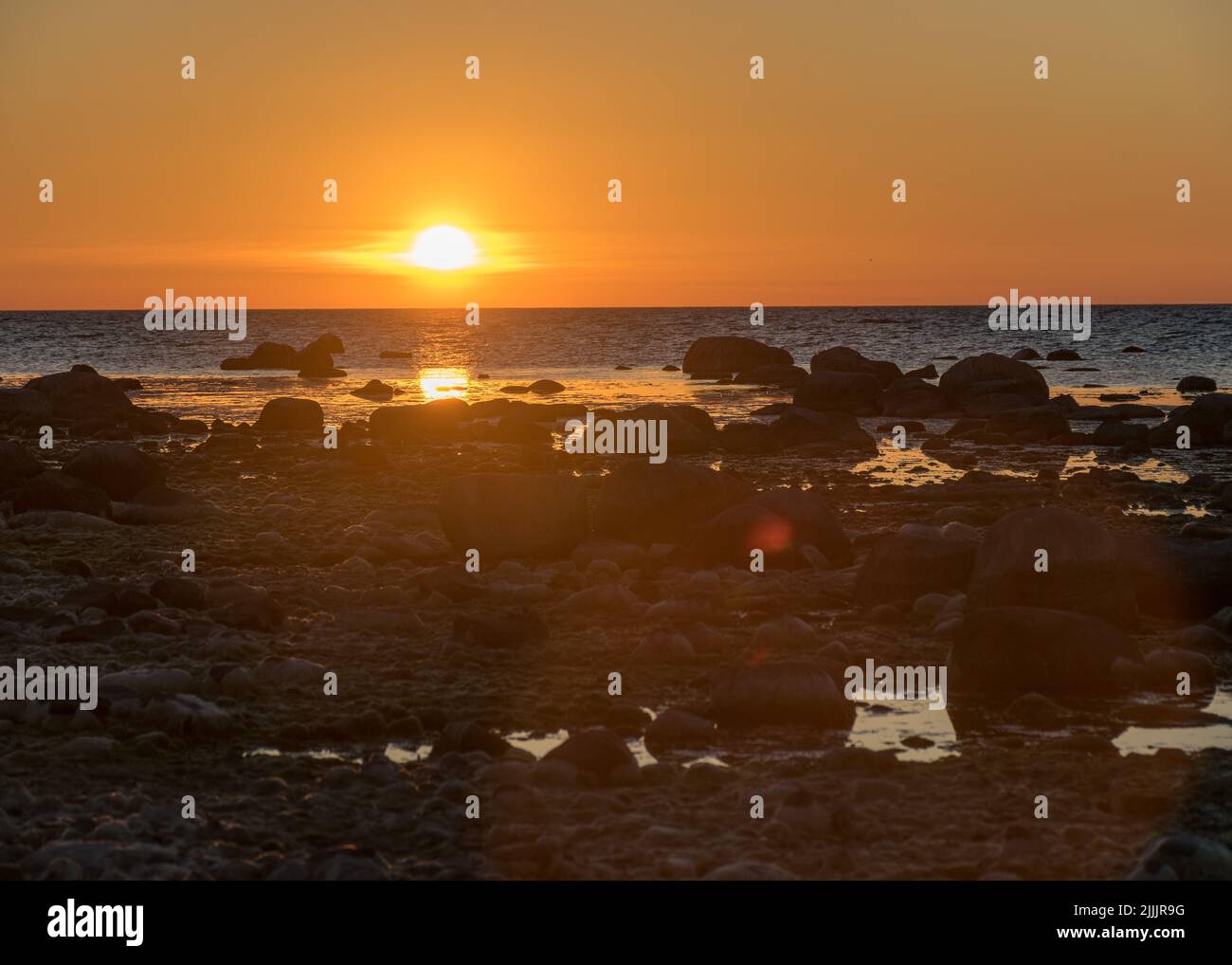 beautiful sunset landscape from a traditional rocky beach on the island ...