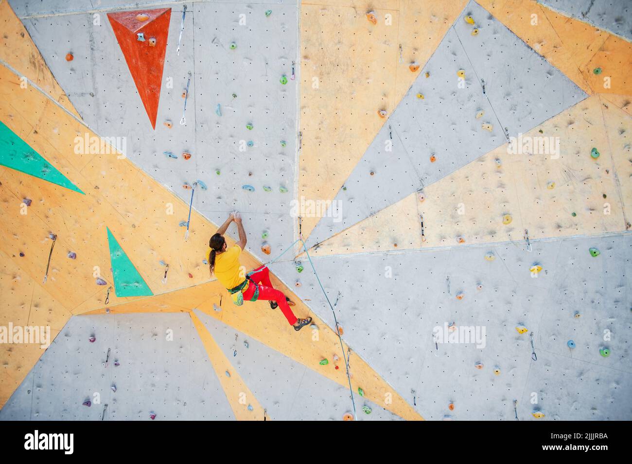 Young and fit man exercise free mountain climbing on outdoor practice ...