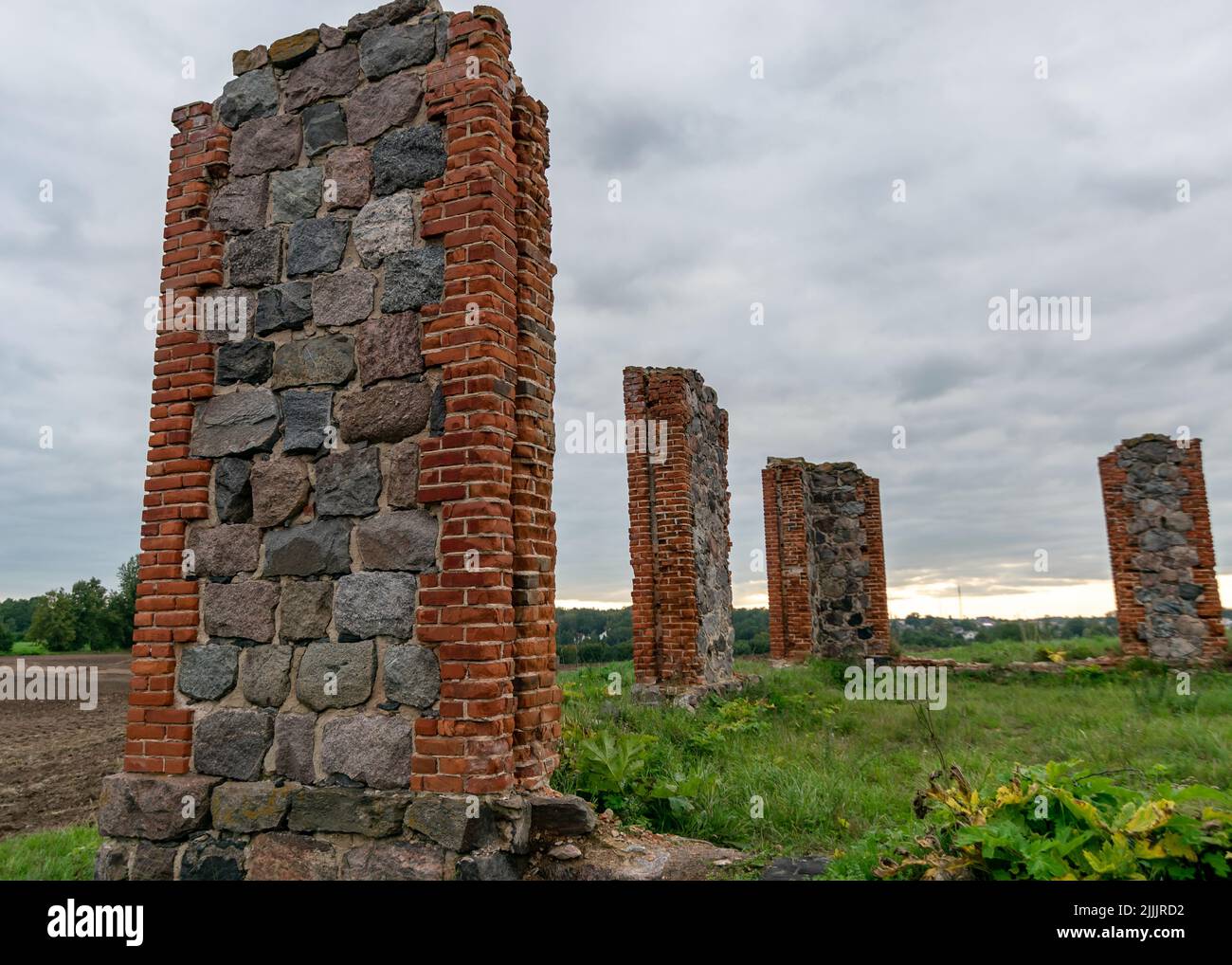 landscape with stone and brick barn ruins reminiscent of one of the ...