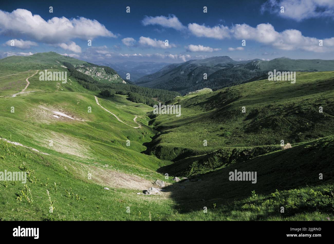 cumulus clouds above valley beetween mountains of Biogradska Gora ...