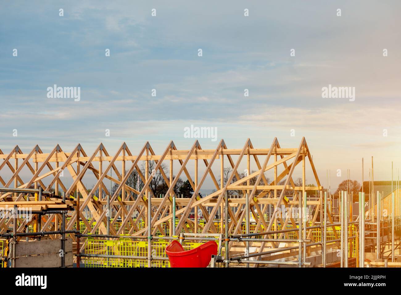 Construction site with a house built from brick and timber, featuring ...