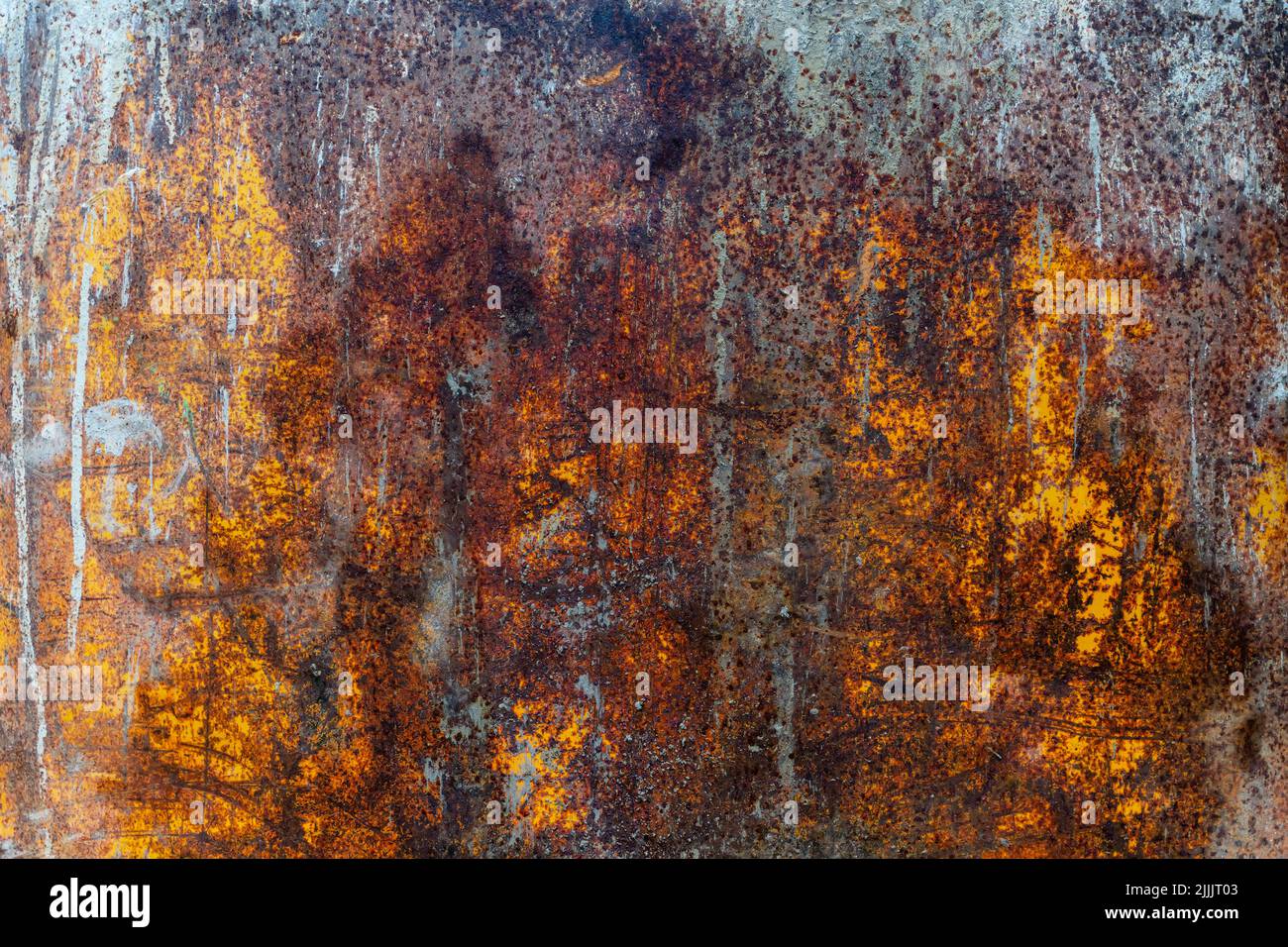 Grunge rusty metal texture background with patches of old yellow paint ...