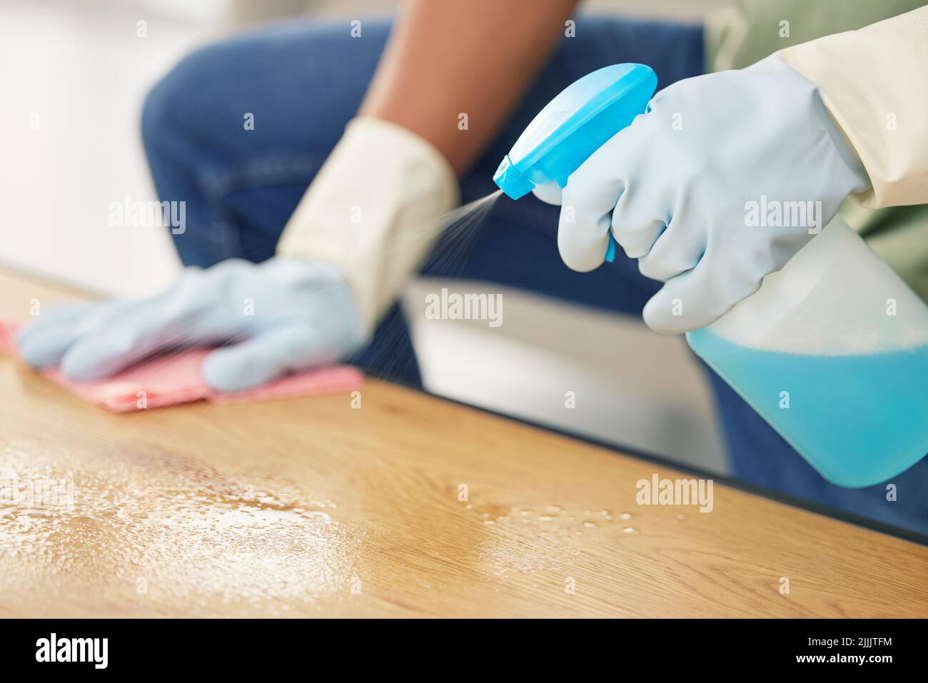 Clean surfaces mean a healthy body. a man cleaning a table Stock Photo ...