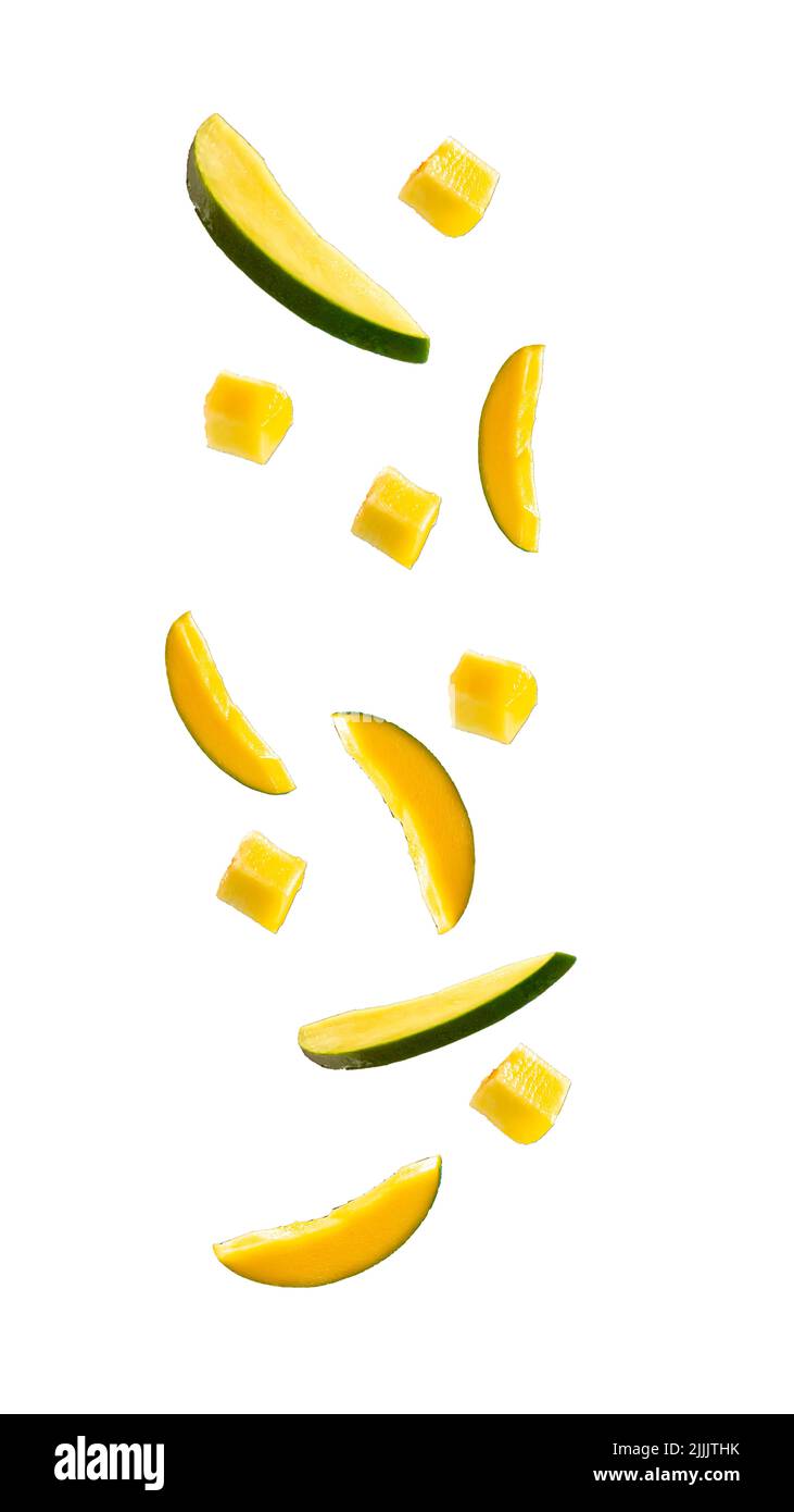 falling mangoes isolated on a white background with a clipping path ...