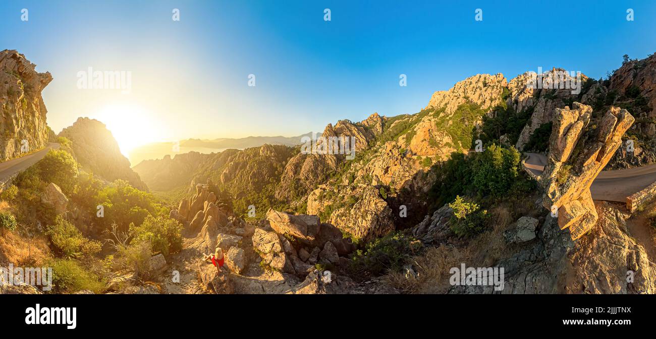 Aerial 360 view of tourist woman on D81 route of Calanques of Piana ...