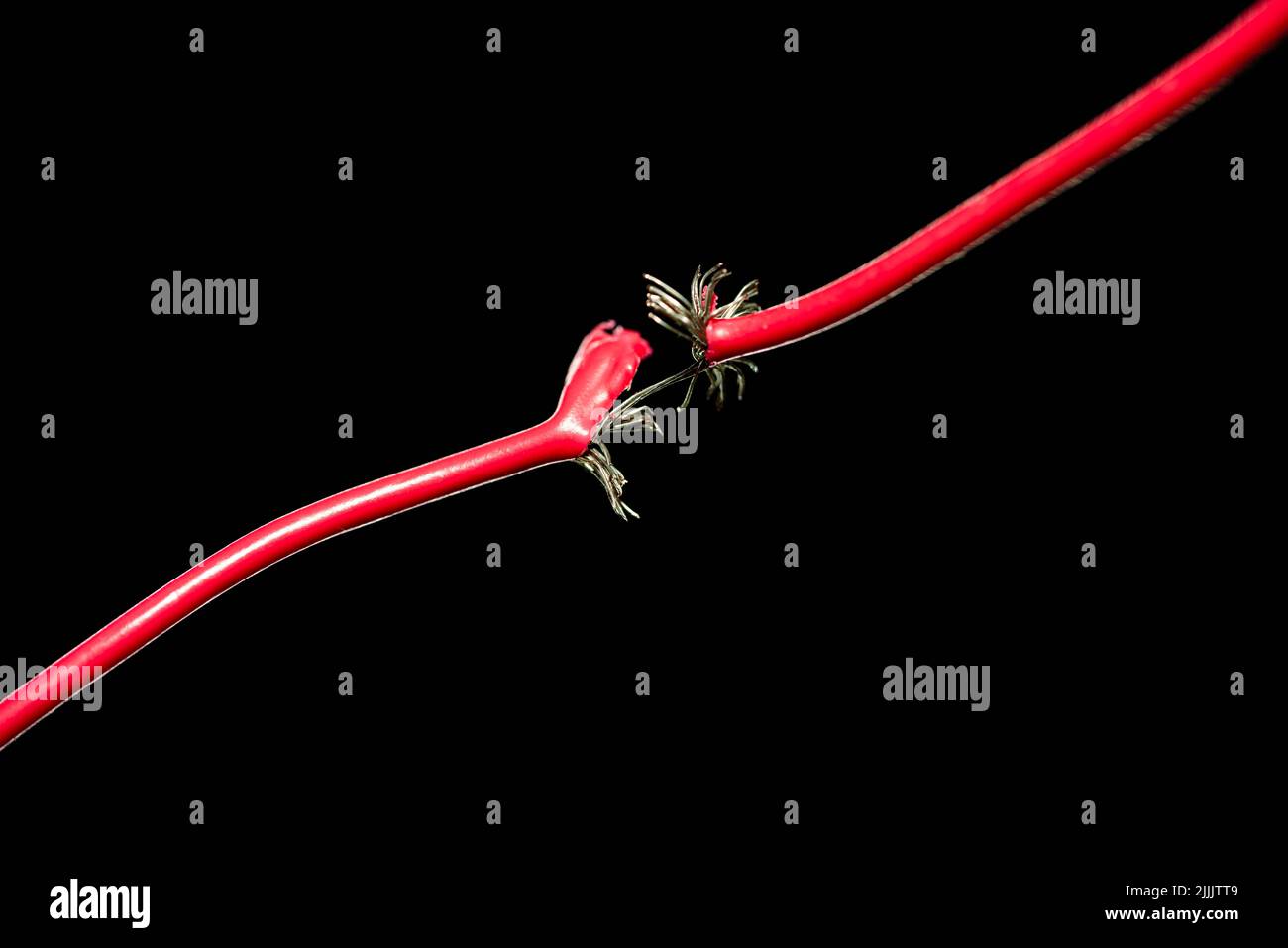faulty defective red electric wire on black background Stock Photo - Alamy