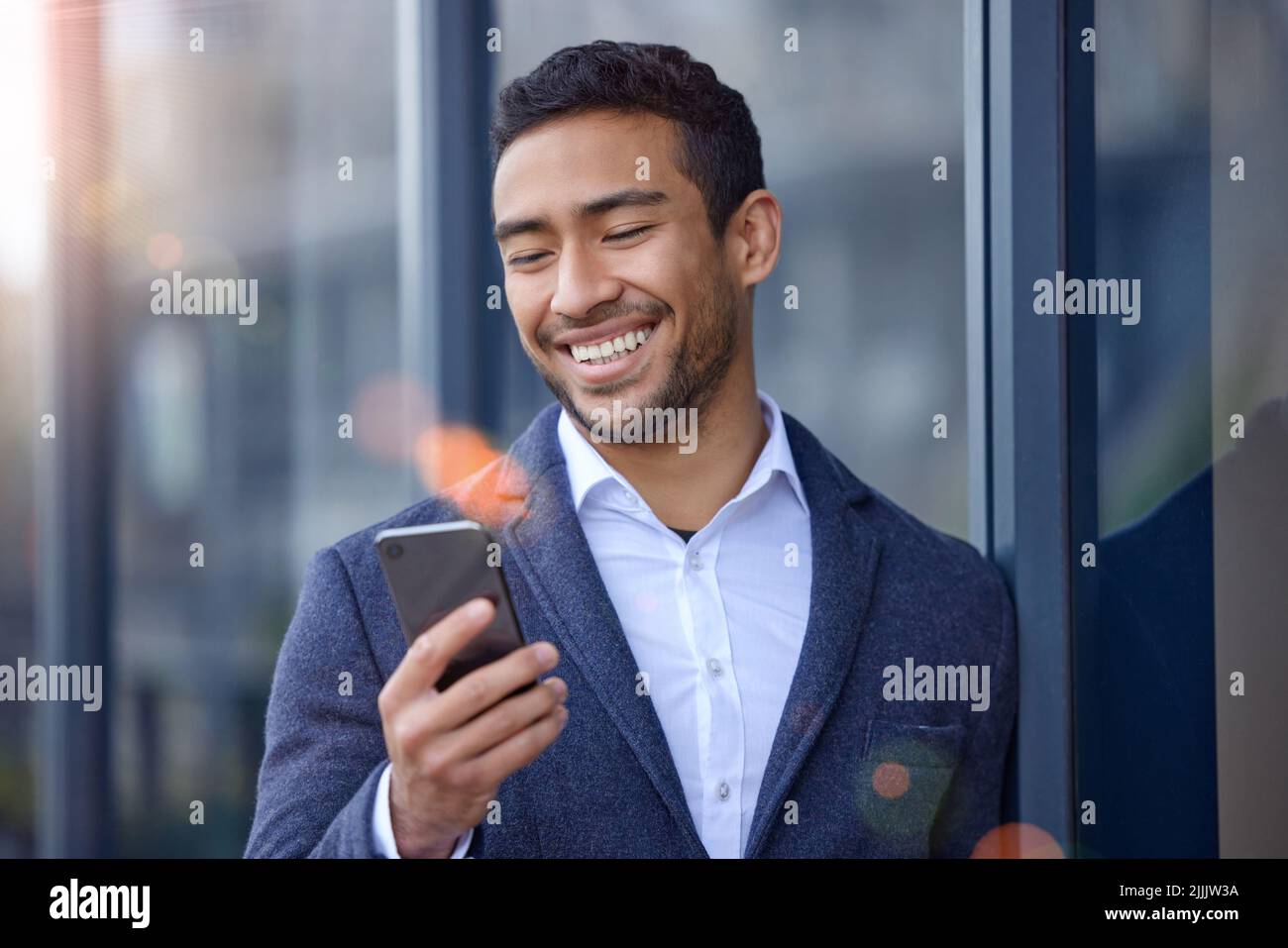 Your messages are like poetry. a young businessman using his smartphone ...