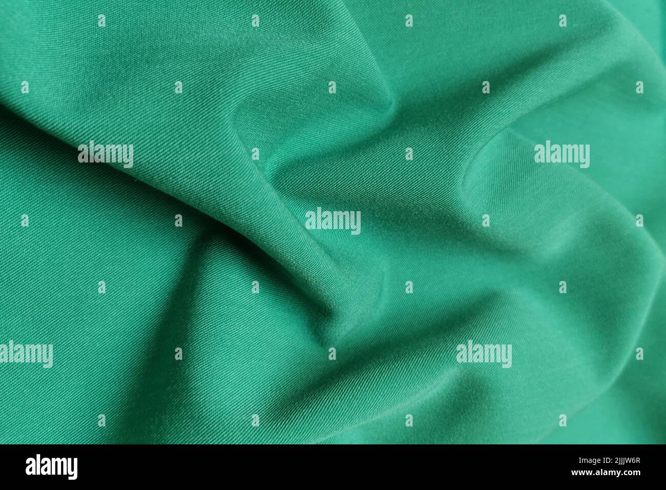 Green galliano fabric crumpled or wavy fabric texture background ...