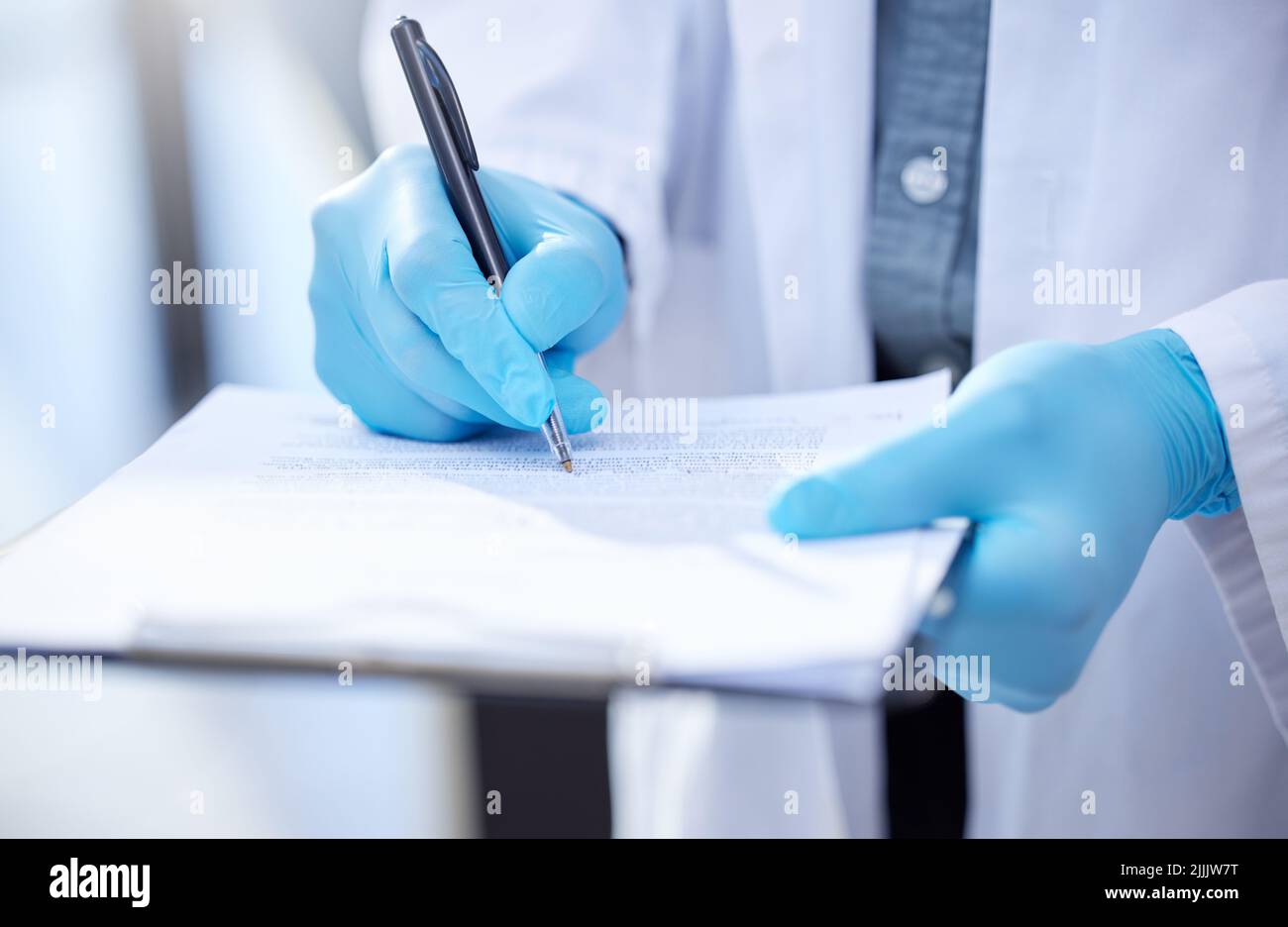 Now all I need is the patients signature. Closeup shot of a male doctor ...