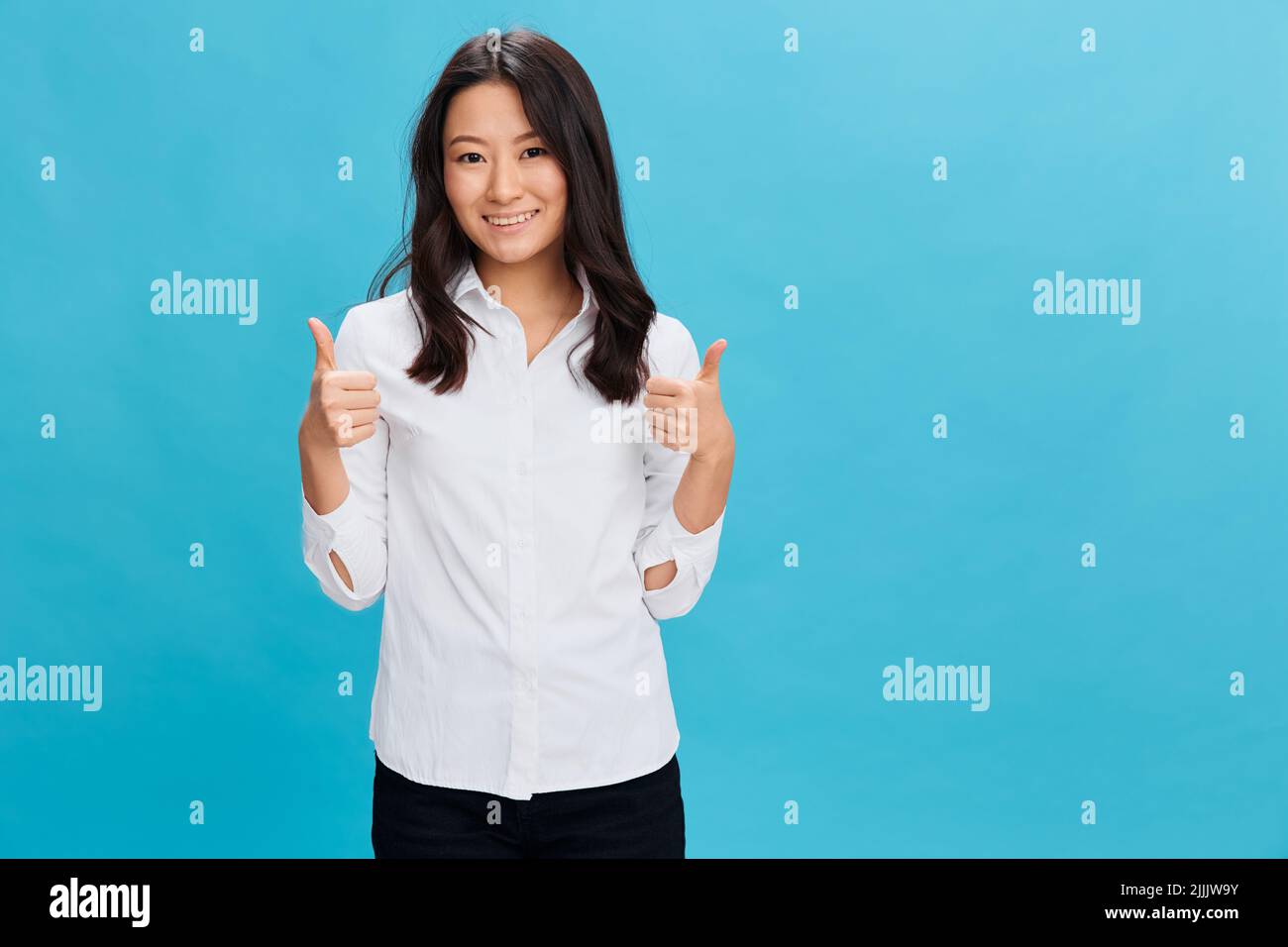 Joyful cute Asian businesswoman in classic office dress code show thumb ...