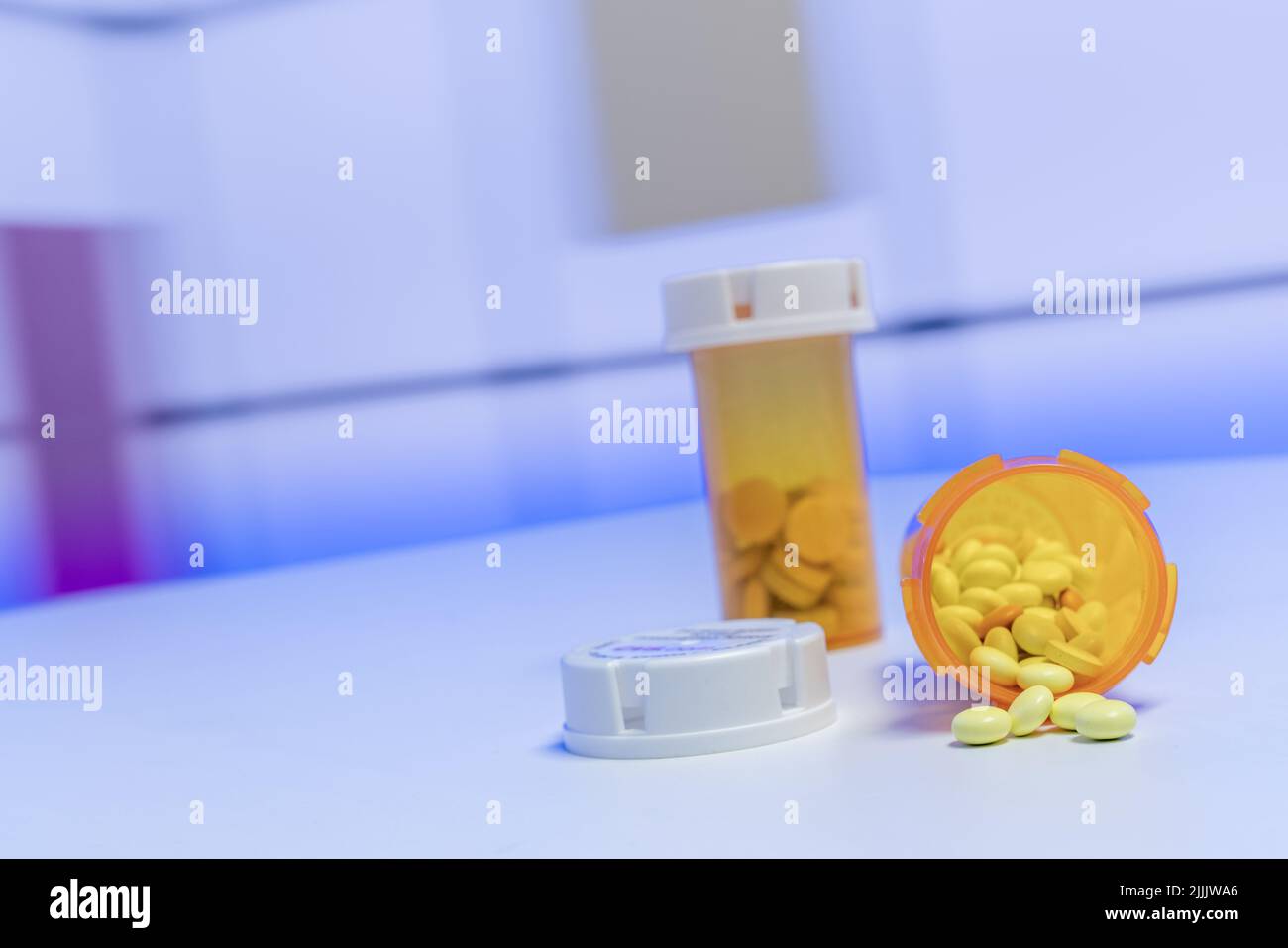 Colorful tablets with capsules and pills on blue background Stock Photo ...