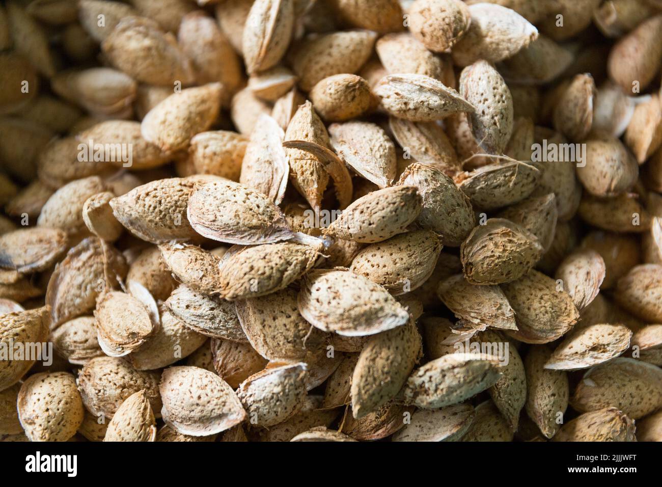Shelled almonds standing on the market stall Stock Photo - Alamy