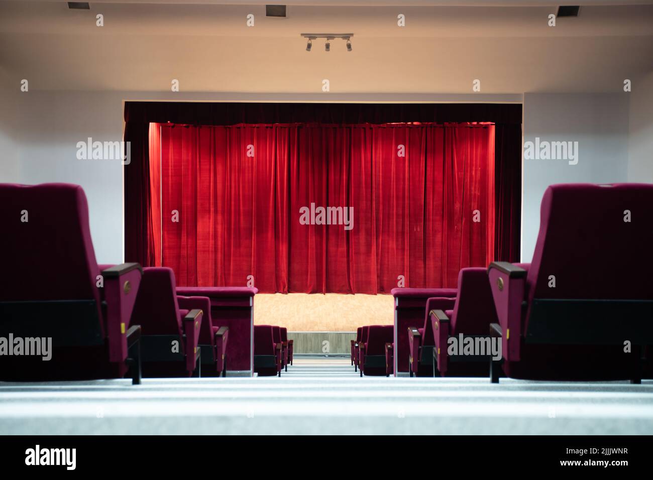 Theater curtain and stage with dramatic lighting Stock Photo - Alamy