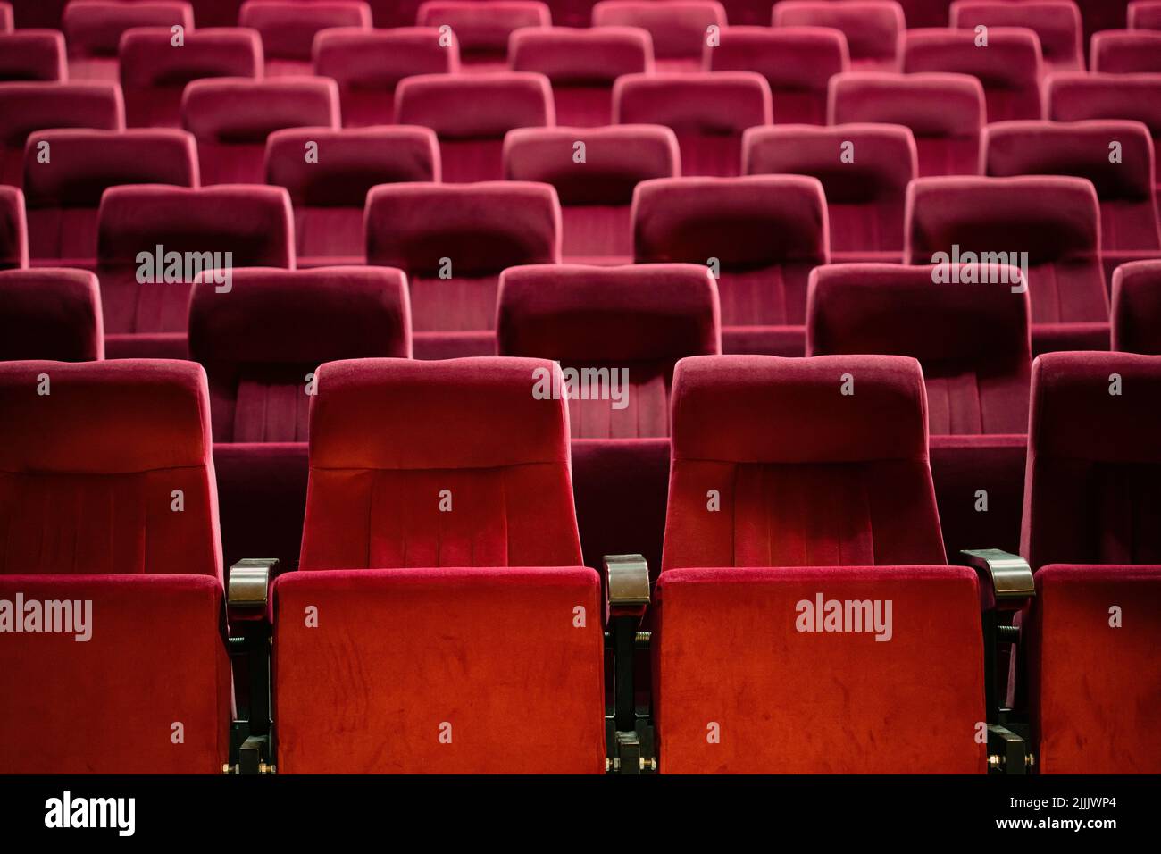 Empty cinema hall with red seats. Movie theatre Stock Photo - Alamy