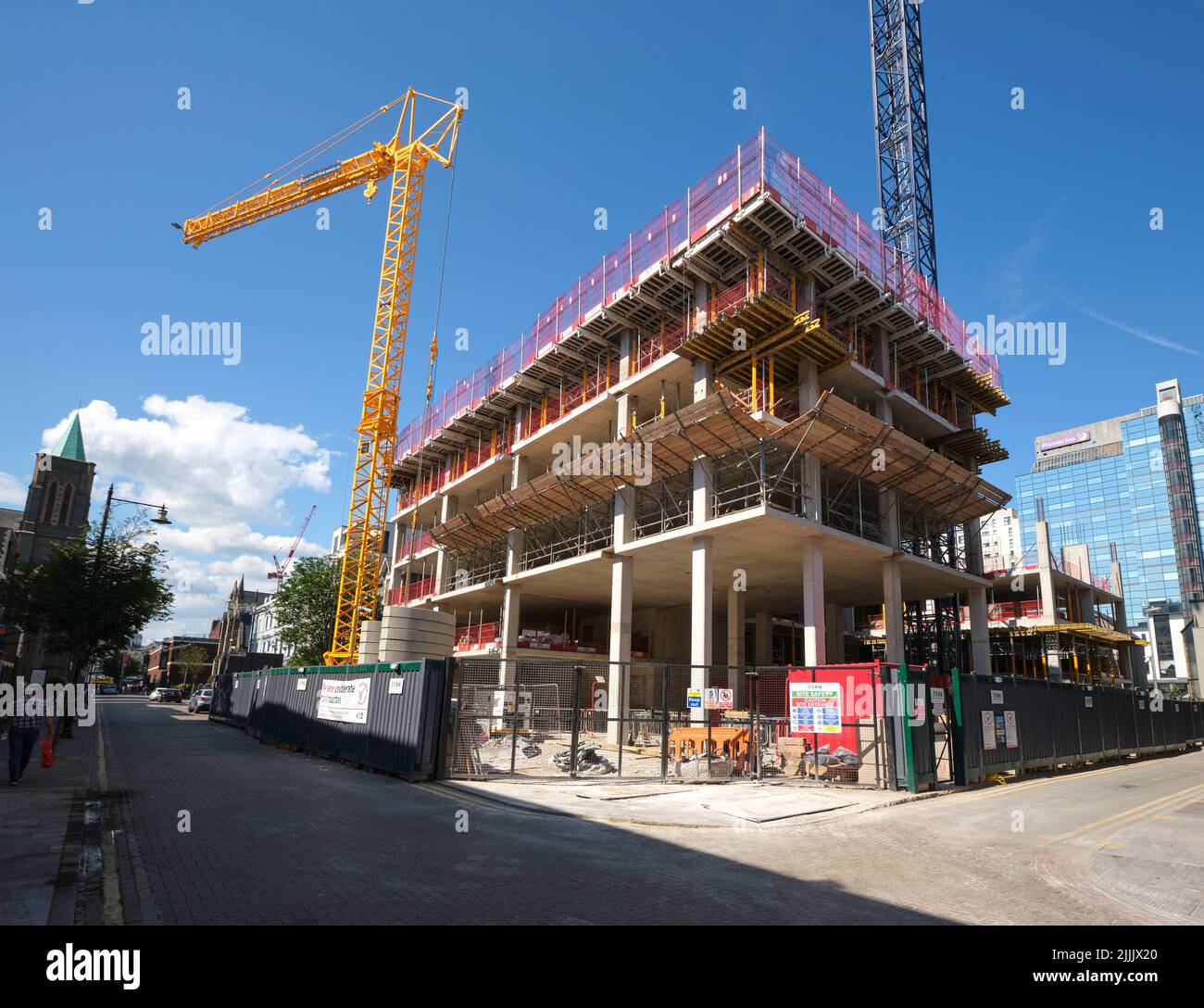 A new concrete apartment building being constructed in downtown. In ...