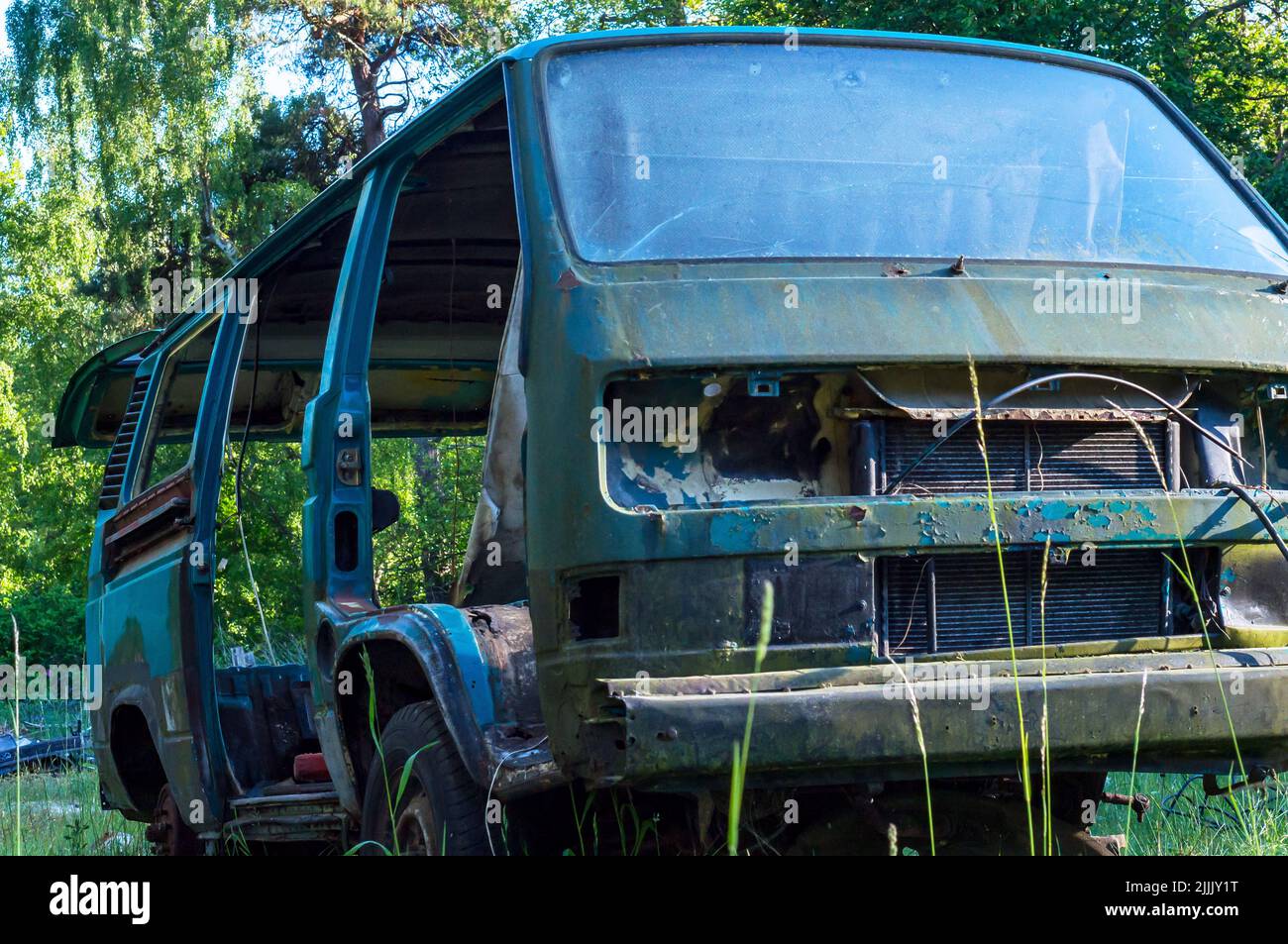 Old, damaged car. Abandoned car in the woods.Defective car. A car unfit for the roads Stock ...