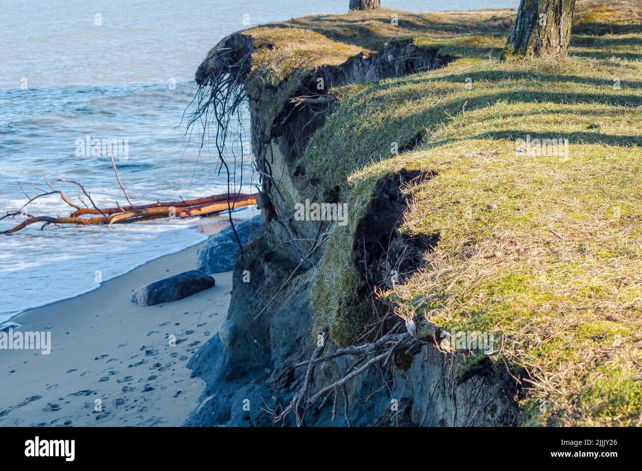 Coastal crumbling after a storm. Destruction on a seashore. The erosion ...