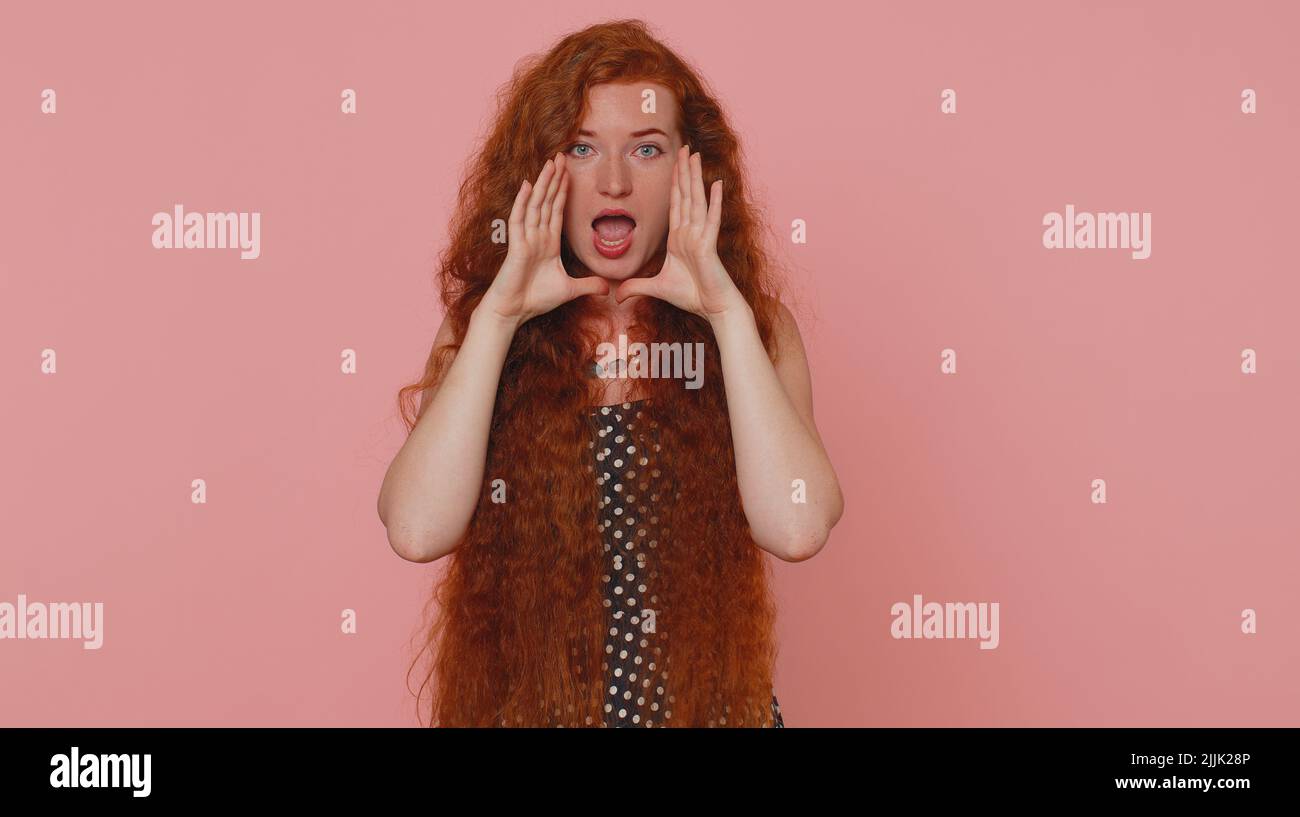 Expressive woman holding hands near mouth loudly screaming, shouting ...