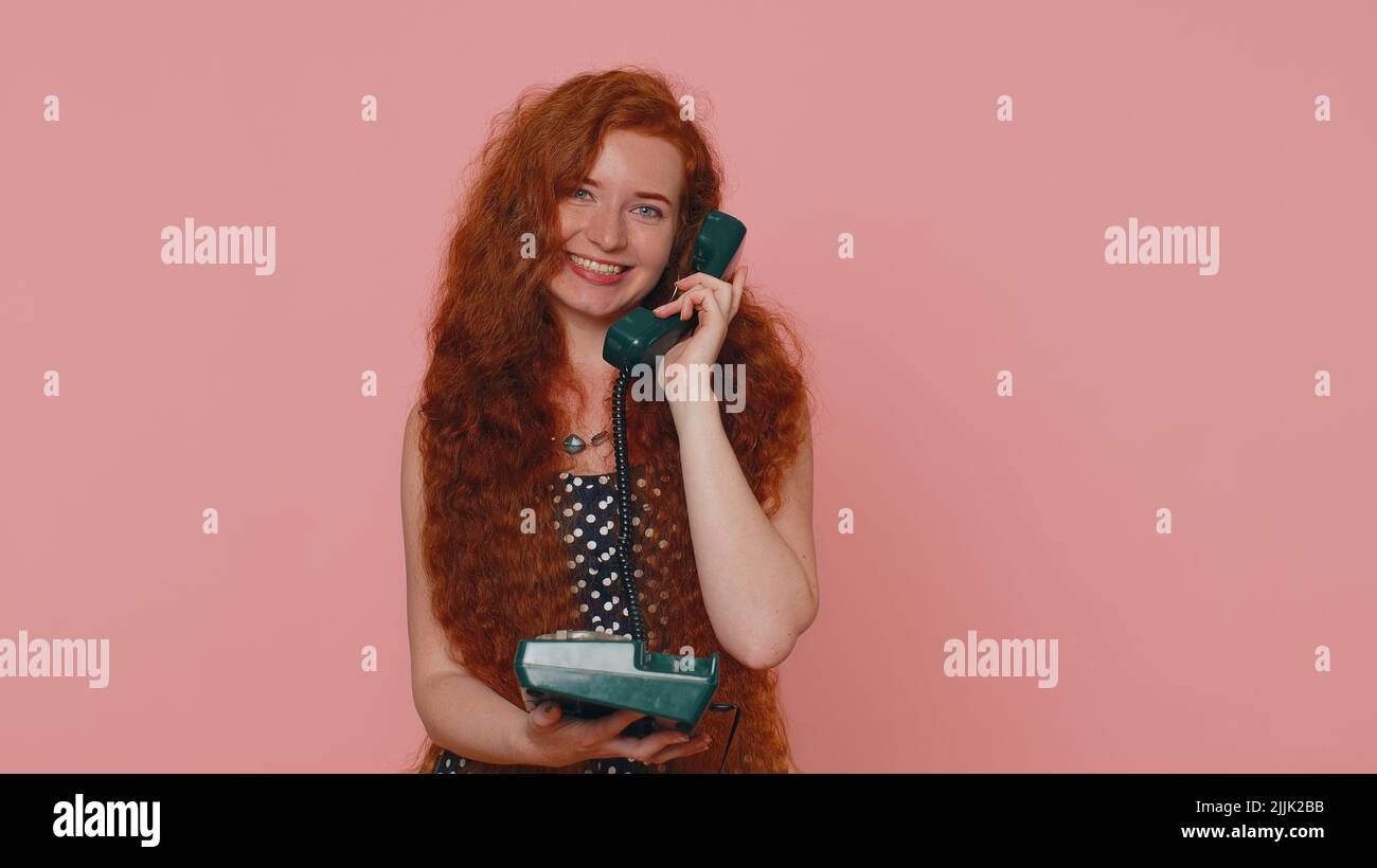 Hey You Call Me Back. Cheerful ginger woman secretary in dress talking ...