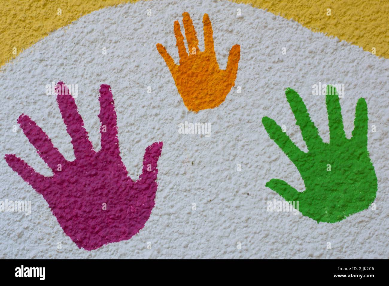 Multicolored handprints on white background. Top view Stock Photo - Alamy