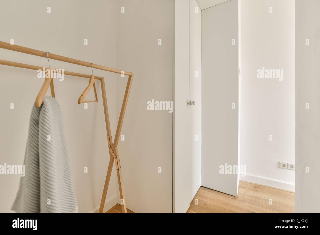 Room with door to balcony and narrow long corridor in perspective in ...