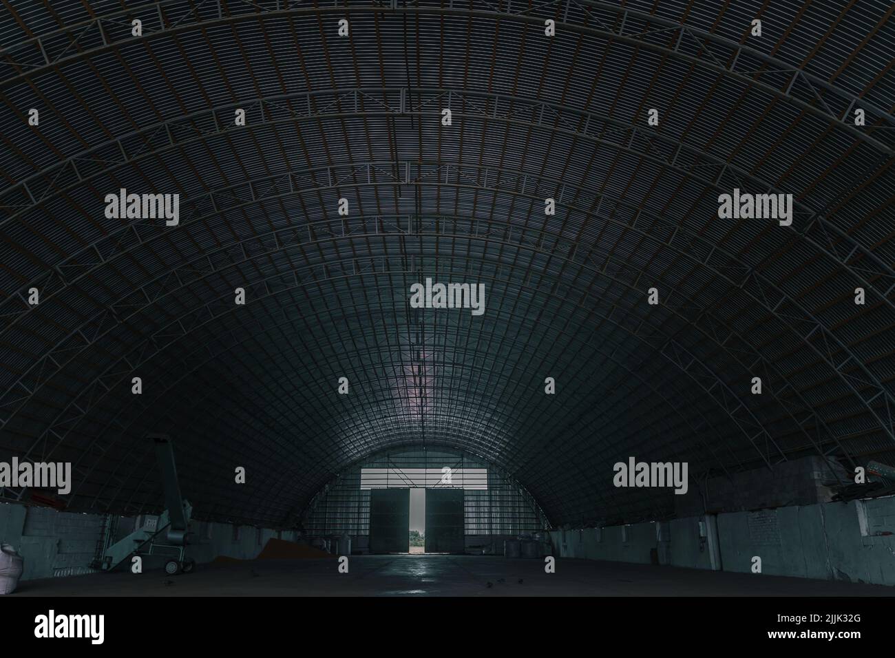 Empty hangar. Manufacturing plant or large warehouse. Metal slabs ...