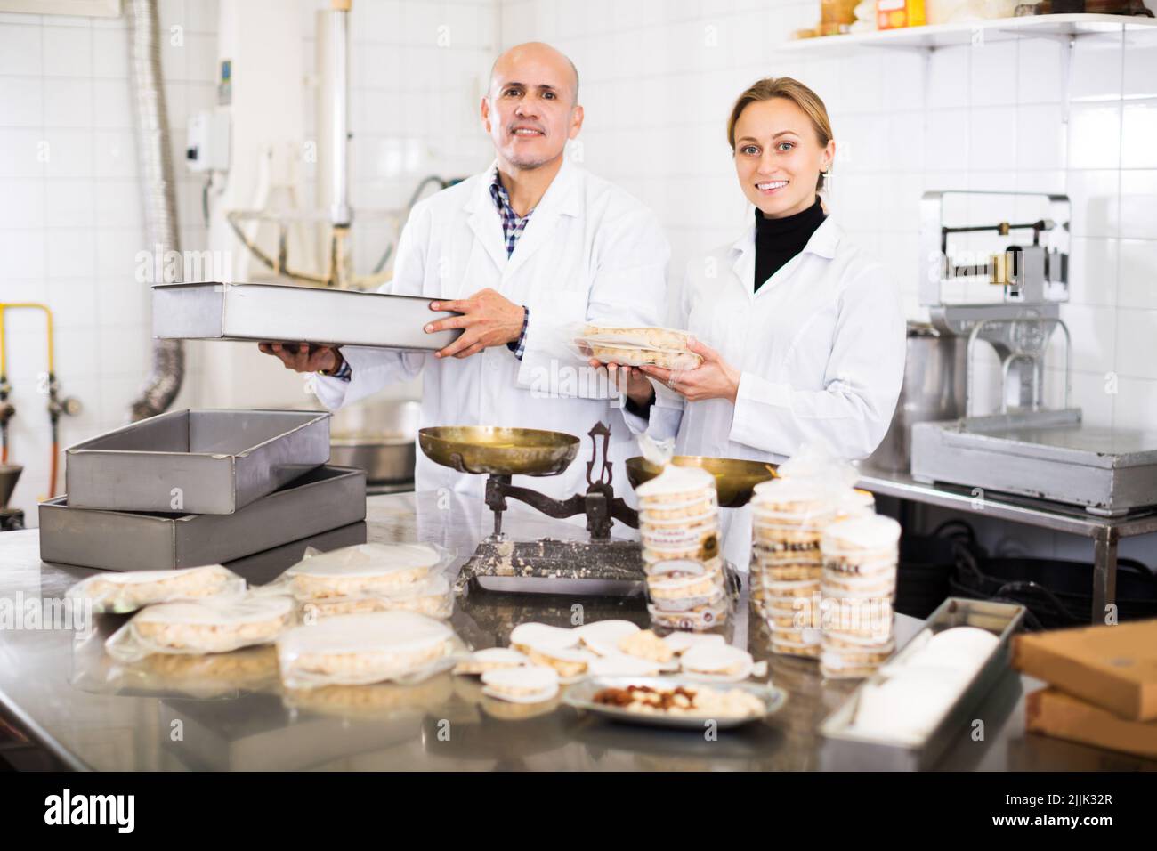 Workers kipping turron in food manufacture Stock Photo - Alamy