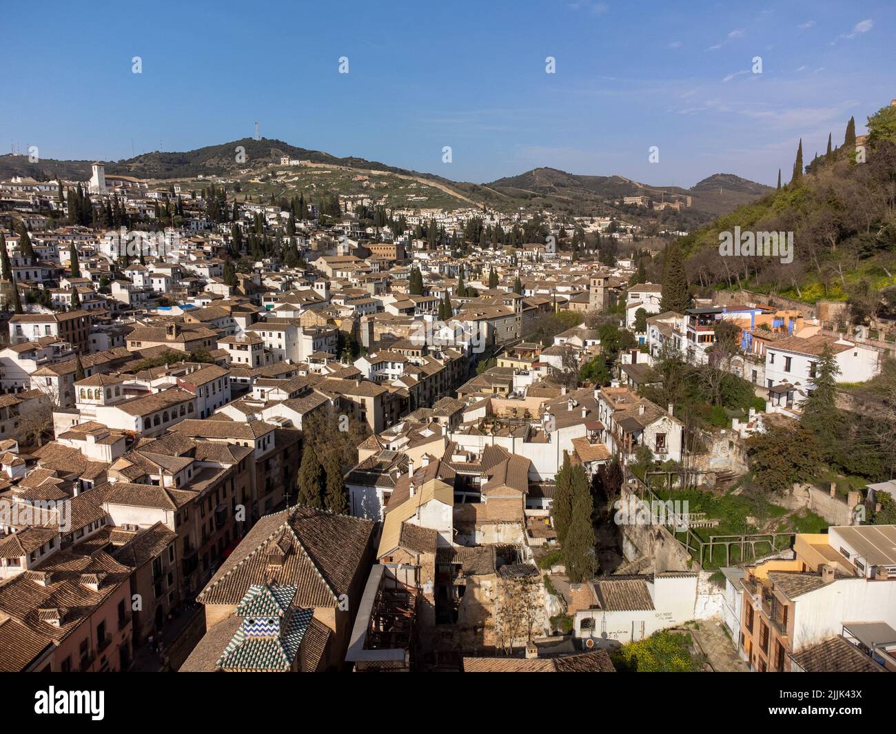 Aerial panoramic view on buildings, old district, mountains and ...