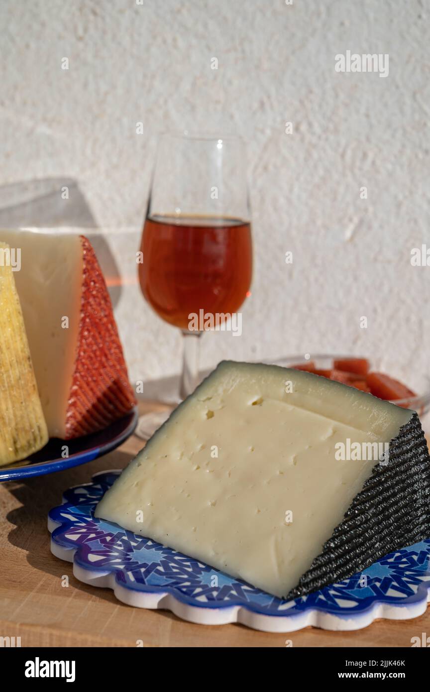 Spanish hard manchego, cow, sheep and goat cheeses served outdoor with ...