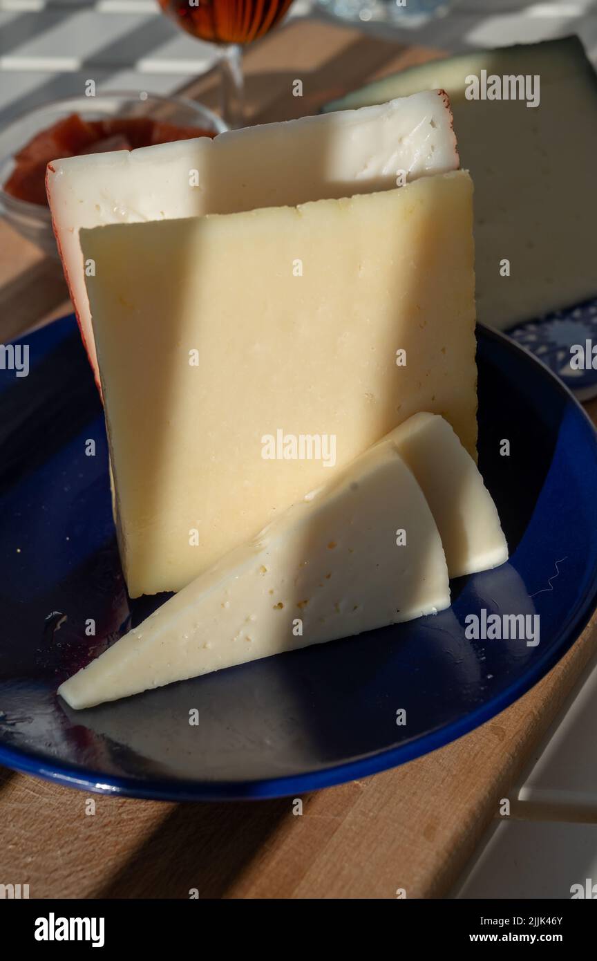 Spanish hard manchego, cow, sheep and goat cheeses served outdoor with ...