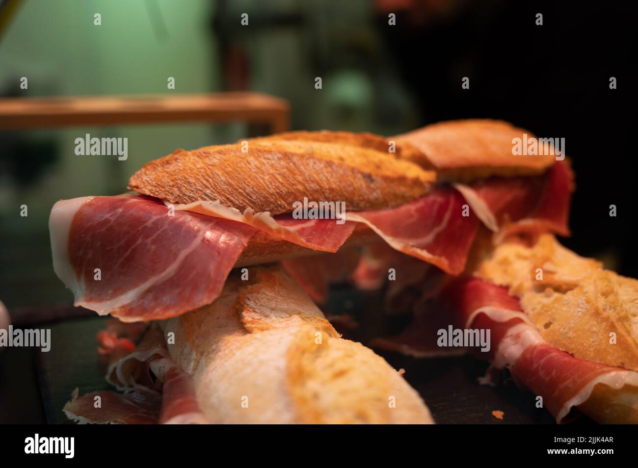 Spanish low cost street food, bocadillo bread sandwich dry-cured ham ...