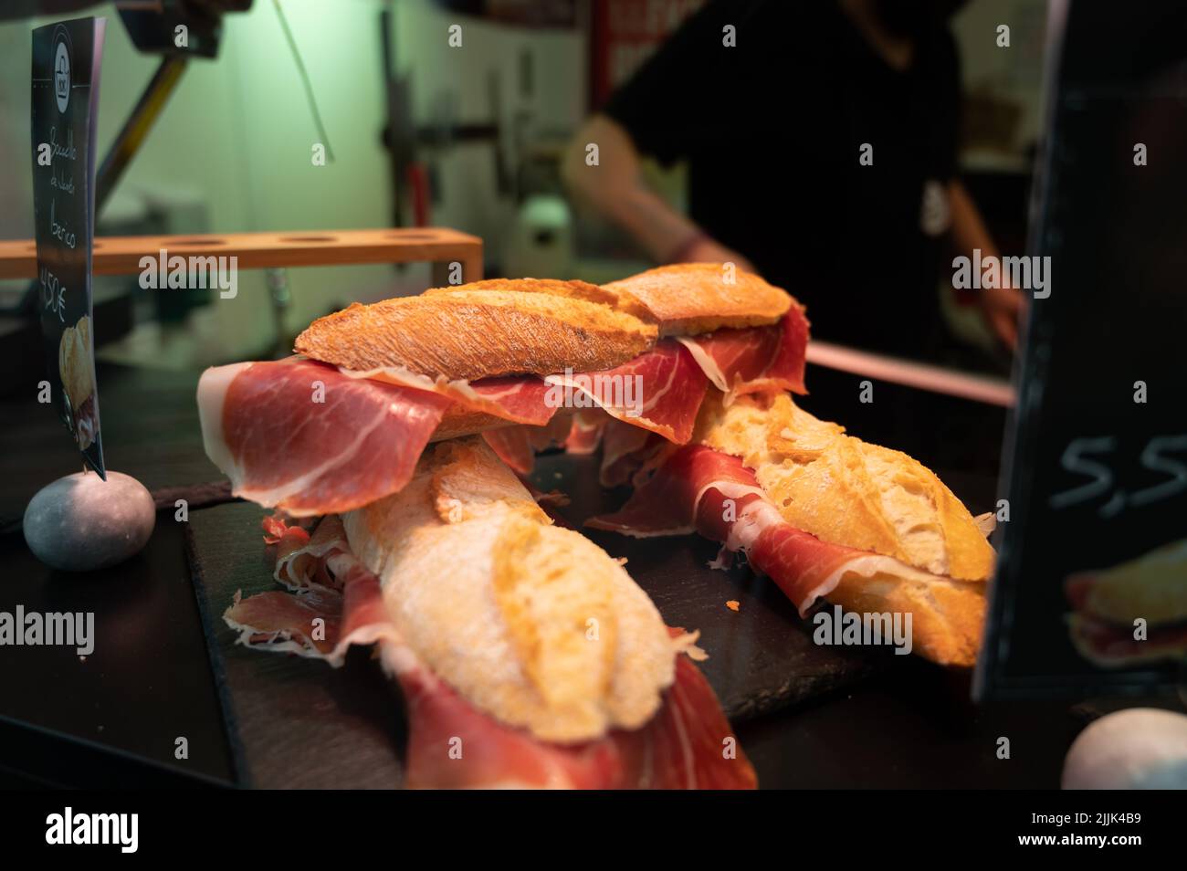 Spanish low cost street food, bocadillo bread sandwich dry-cured ham ...