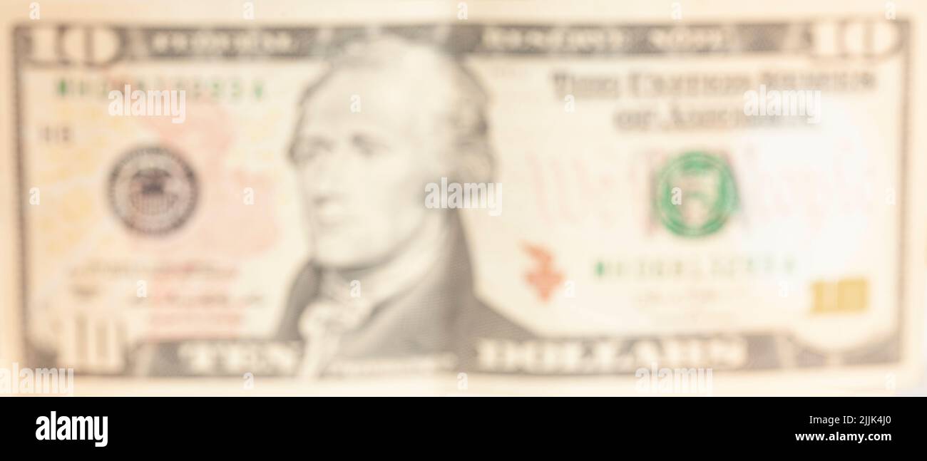 ten dollars bill blurry background Stock Photo - Alamy