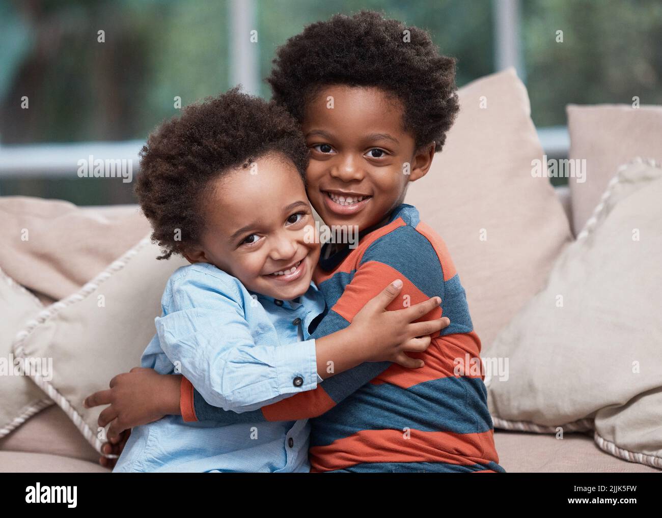 African boys hug hi-res stock photography and images - Alamy