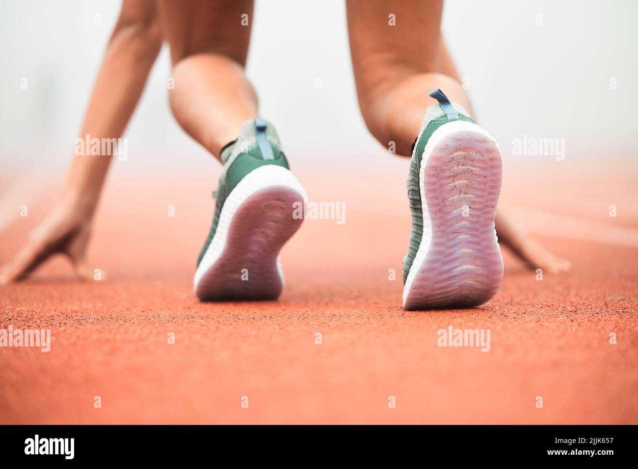 Shes all set. Rearview shot of an unrecognizable young sportswoman ...