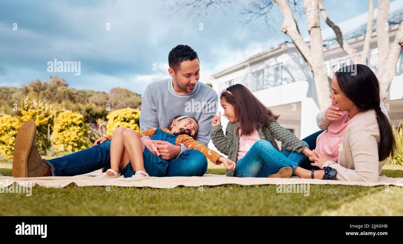 An outdoor family day. a young family having a picnic in a park Stock ...