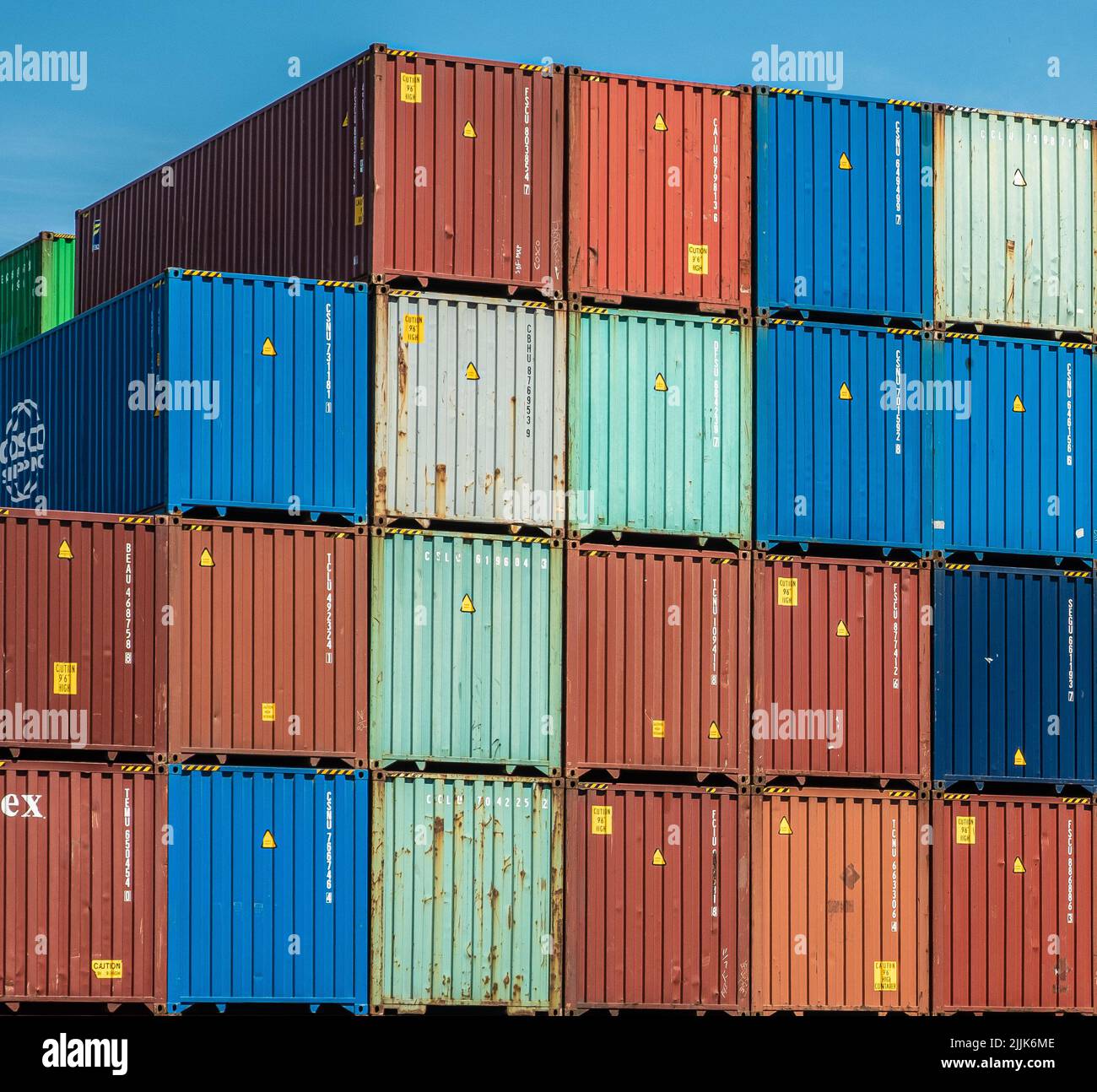 The brightly colored shipping containers stacked at the Port of ...