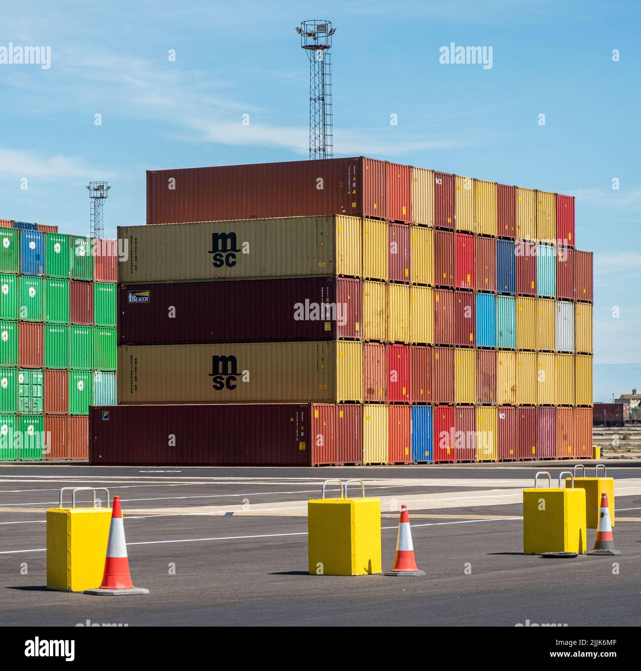 The brightly colored shipping containers stacked at the Port of ...