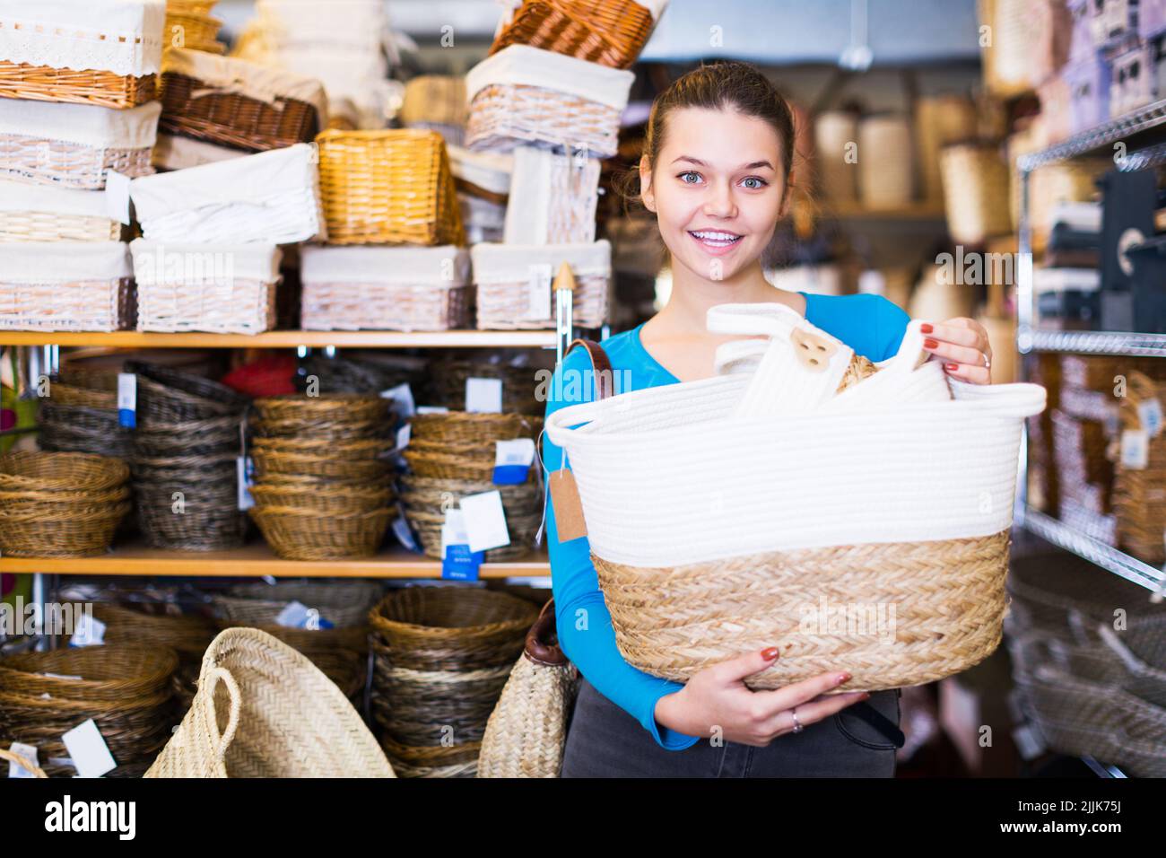 customer standing with wicker basket Stock Photo - Alamy