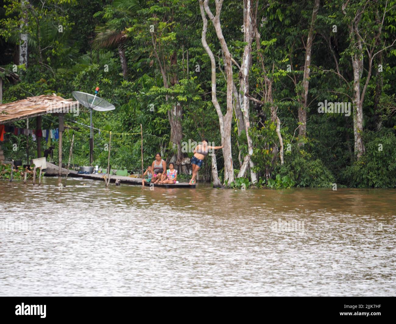 A family living at the shore of the Amazon river in Manaus, Brazil ...
