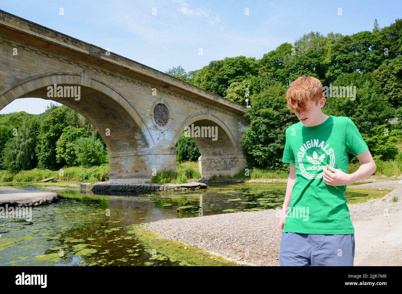 historic coldstream bridge on river tweed on england and scotland ...