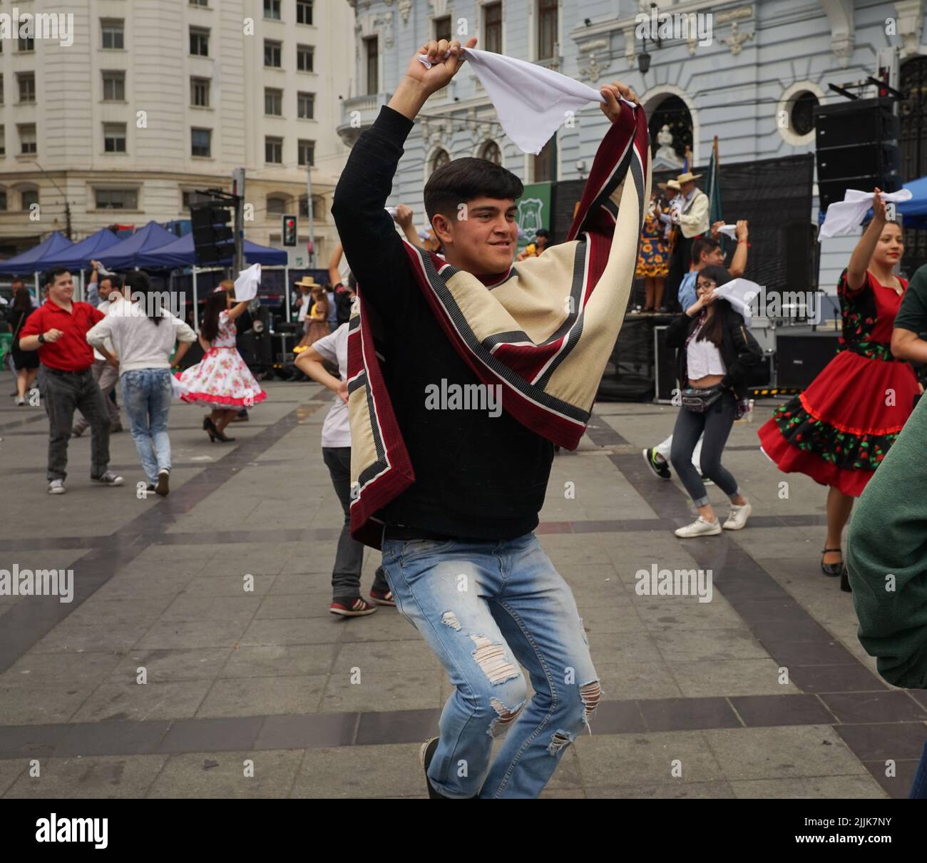 A closeup of people dancing a traditional dance in Plaza Sotomayor ...