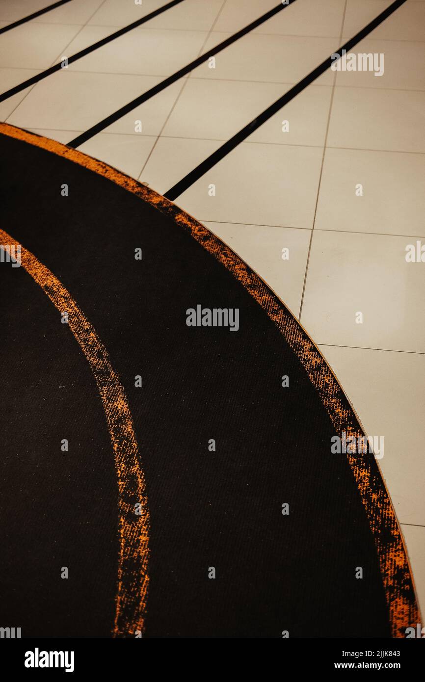 A vertical shot of a floor with tiles and a circular place Stock Photo ...