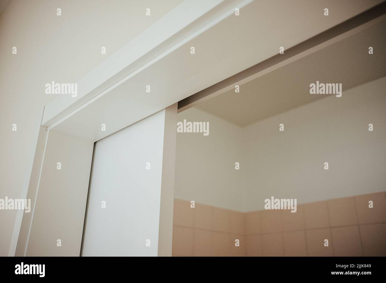A low angle shot of a part of a room with an open door Stock Photo - Alamy