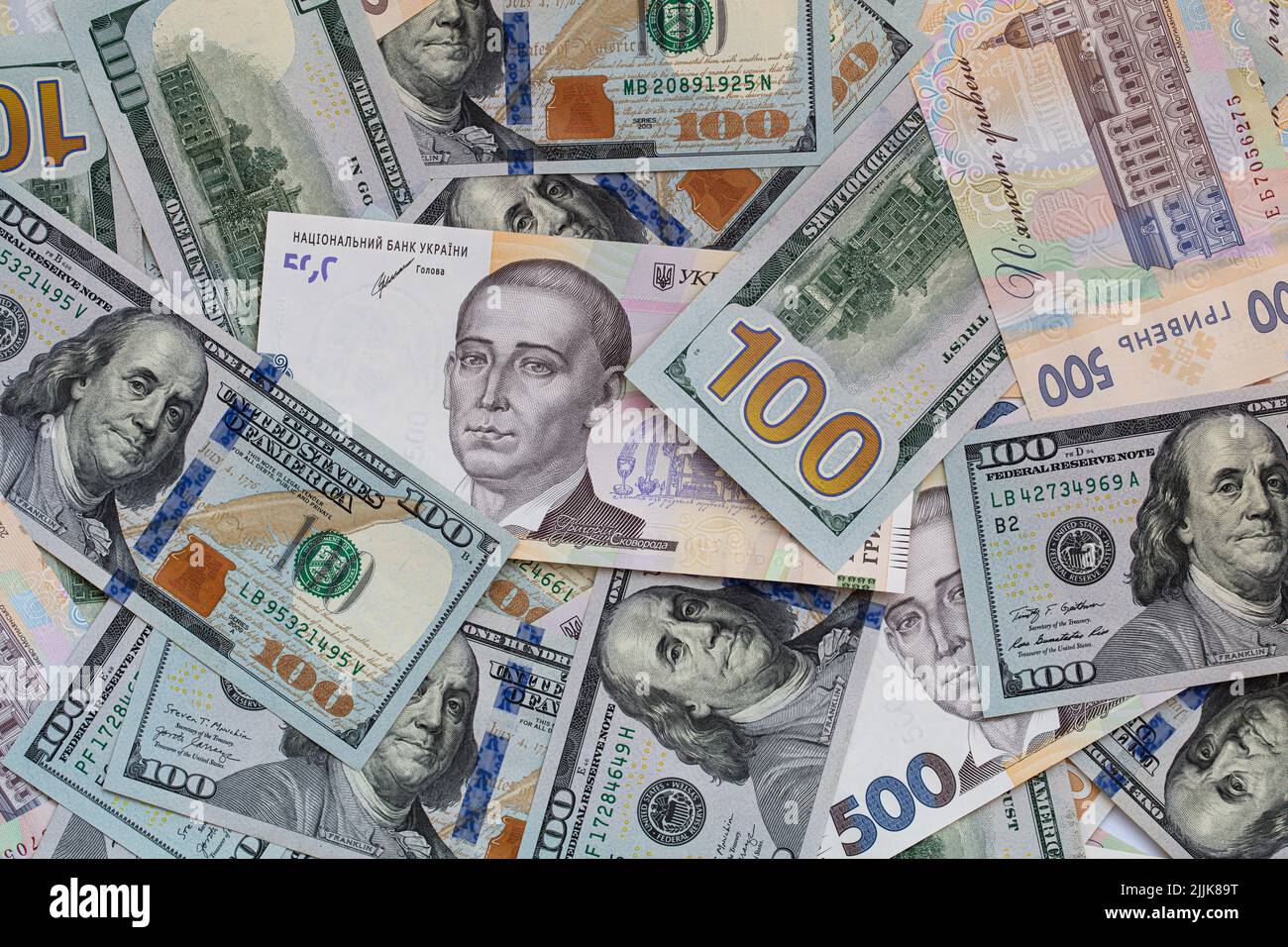 100 dollar and 500 hryvnyas banknotes background for design purpose ...