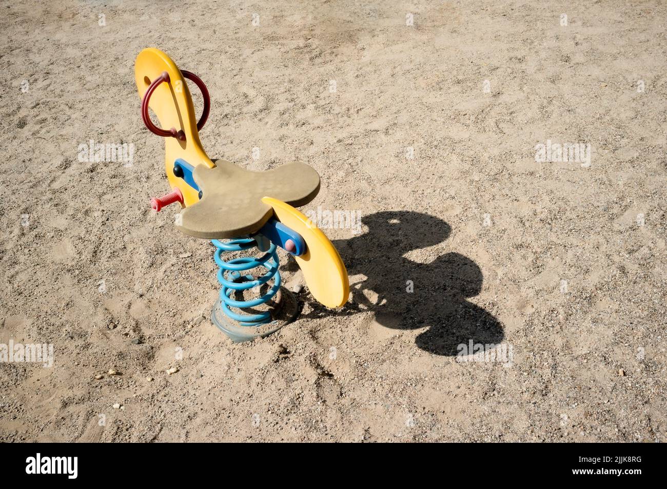 A closeup view of children carousel under shadow Stock Photo - Alamy